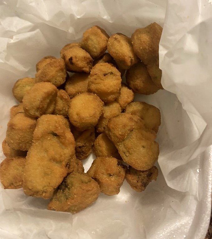 Fried okra that defies the vegetable's slimy reputation. These golden nuggets convert even the most stubborn okra skeptics with their crispy, seasoned exterior.