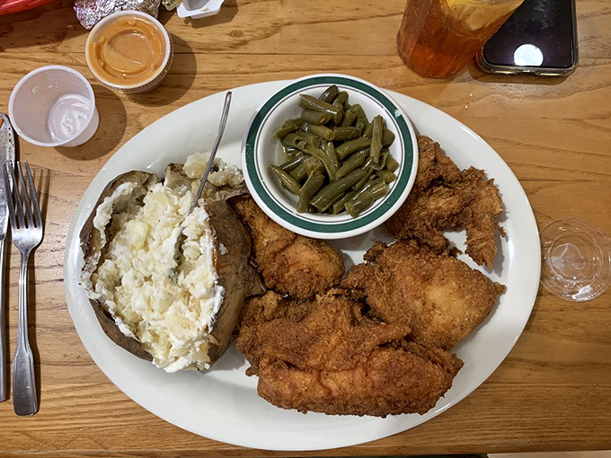 Southern fried chicken done right&mdash;crispy, seasoned coating protecting juicy meat, with green beans that clearly simmered with something porky and wonderful.