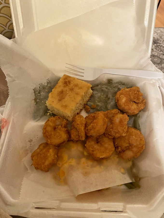 Golden-fried shrimp, mac and cheese that's actually cheesy, candied yams, and lima beans. This styrofoam container holds more happiness than most luxury restaurants.