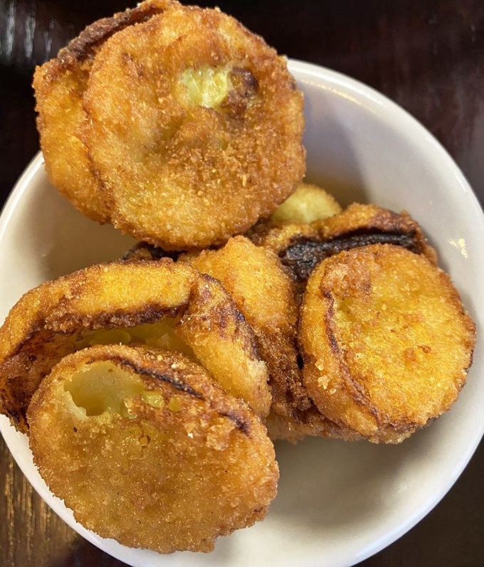 Fried squash with a golden crust that shatters with each bite. Proof that vegetables can be both virtuous and deliciously sinful.