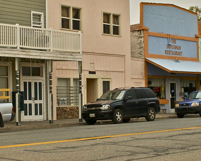 The Dutchman Restaurant's vintage sign promises the kind of meal where calories don't count because you're technically on vacation.