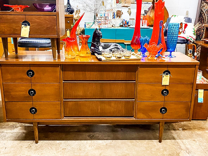 That mid-century credenza with vibrant glass sculptures is practically begging to host your next cocktail party. Martini glasses not included.