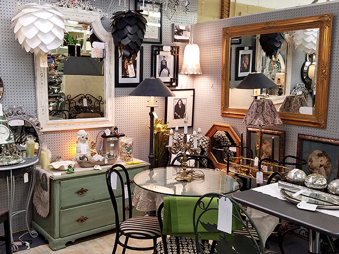 A vignette of elegant living from another era&mdash;where mint-green furniture and ornate mirrors create the perfect backdrop for your next Instagram-worthy find.