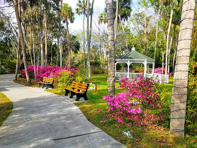 A garden path that belongs in a fairy tale, where vibrant azaleas frame a gazebo that's hosted countless marriage proposals and family photos.