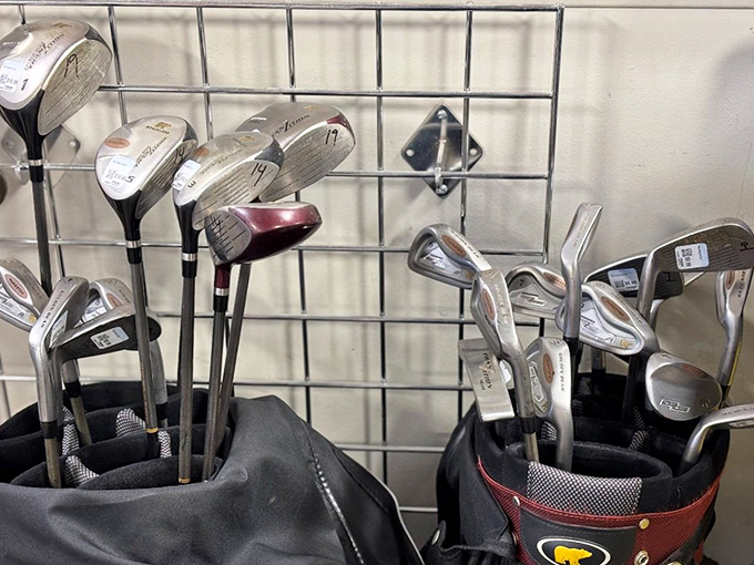 Golf clubs lean together like old friends at a reunion, sharing silent stories of perfect drives and spectacular slices from fairways past.