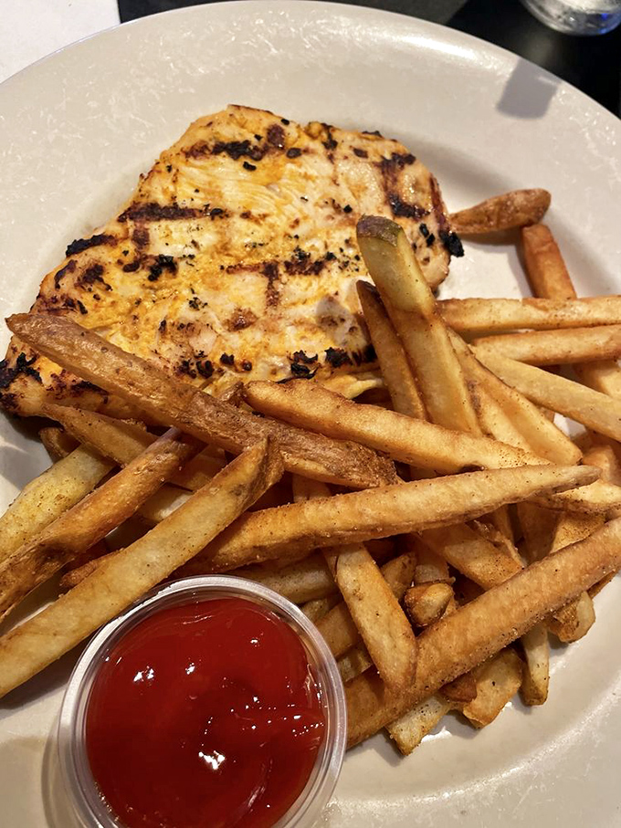 Comfort food doesn't always wear casual clothes&mdash;sometimes it dresses up like this perfectly grilled chicken alongside hand-cut fries.