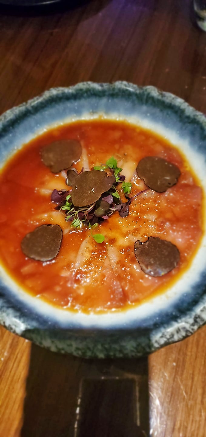 Someone took raw fish, added truffle, and created this masterpiece that looks like modern art but tastes like pure luxury.