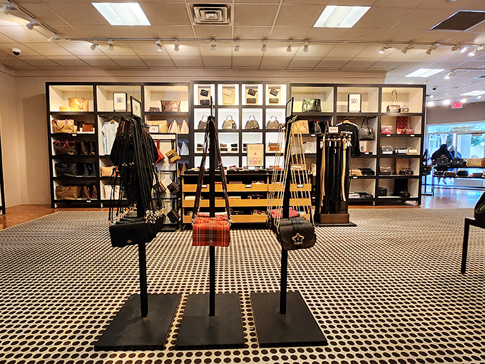 Coach's handbag display: where accessory dreams come true without requiring a loan application. The black and white floor adds just the right touch of drama.