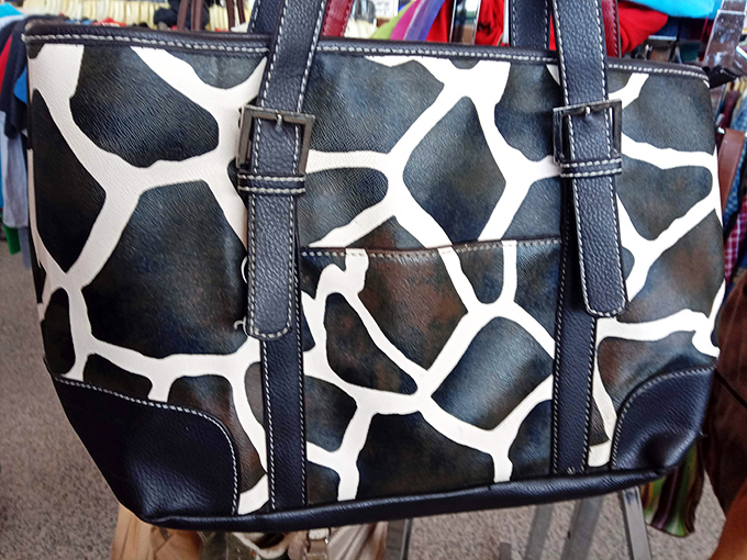 Animal print never truly goes extinct. This giraffe-patterned handbag is ready for its second safari through the urban jungle.