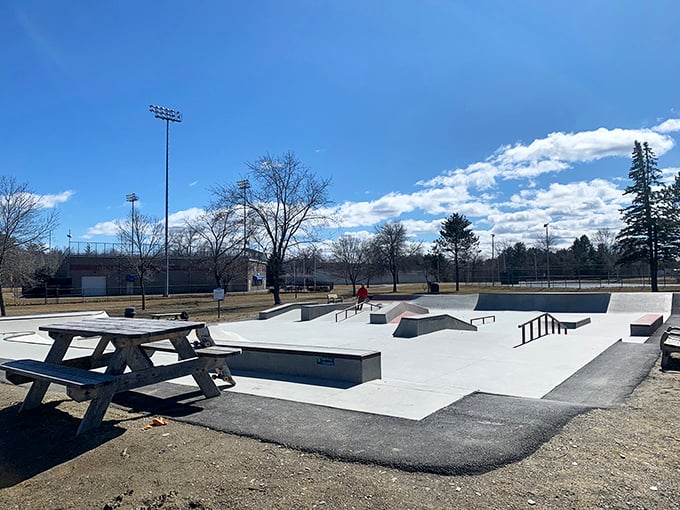 The Bangor Skatepark's concrete playground stands ready for gravity-defying feats under Maine's characteristically dramatic sky.