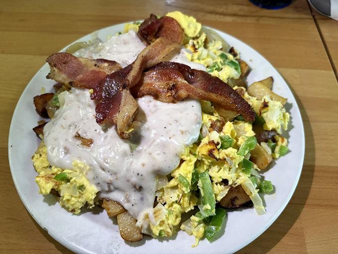 The Haystack Scramble &ndash; where potatoes, eggs, and country gravy perform a beautiful breakfast ballet. Bacon conducts this morning symphony.