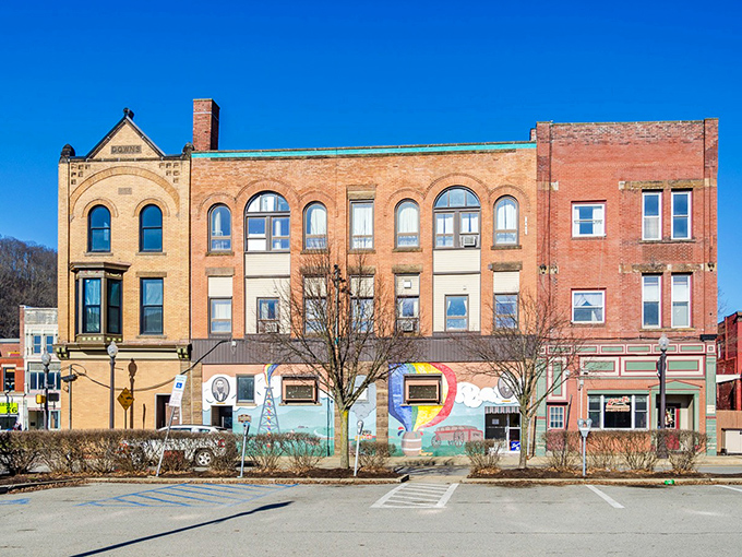 These historic facades create a perfect small-town tableau, complete with colorful murals celebrating Oil City's heritage. The hills beyond remind you nature's never far away.