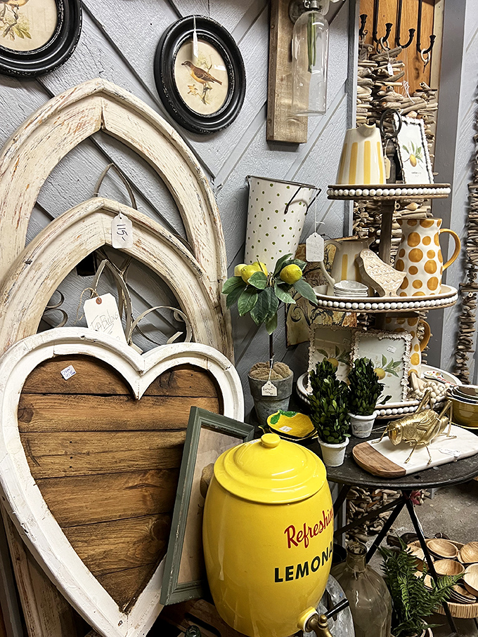 Lemon-yellow accents pop against weathered wood and architectural salvage. That vintage lemonade dispenser isn't just decor&mdash;it's summer memories waiting to happen.