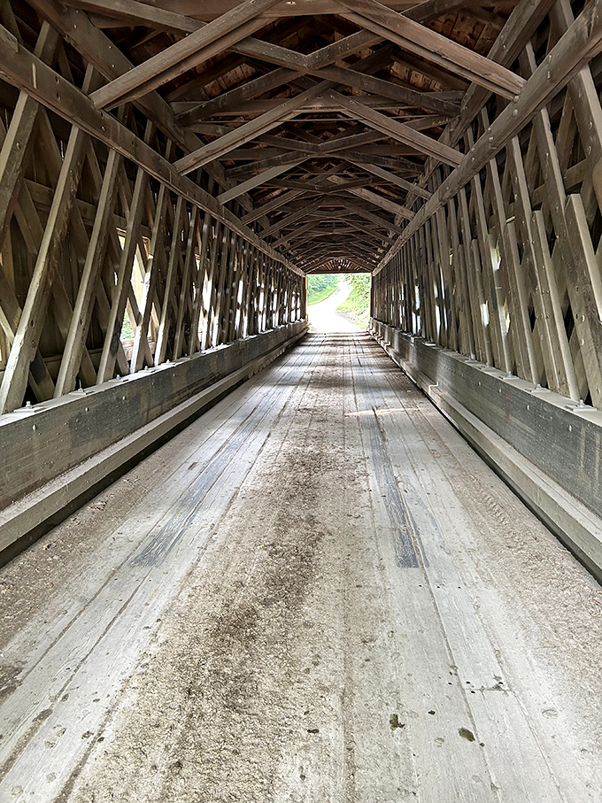 That Town lattice truss design overhead is basically wooden engineering poetry that's been holding strong for generations now.
