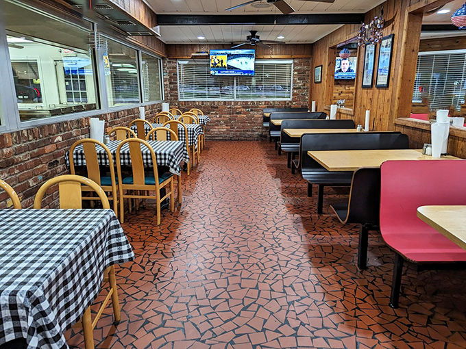 The distinctive terracotta floor and wood-paneled walls create that timeless barbecue joint atmosphere that no modern restaurant designer could improve upon.