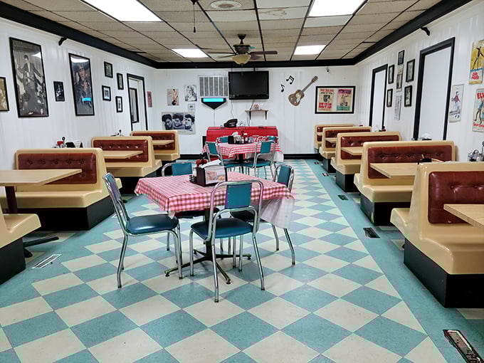 Another dining room reveals more retro charm with cream-colored booths and turquoise accents. Even the floor tiles coordinate with the diner's nostalgic vibe.