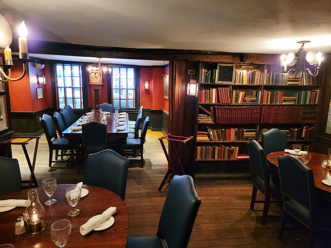 A library-themed dining space where leather chairs and bookshelves create an atmosphere that makes you want to linger over dessert and philosophical conversation.