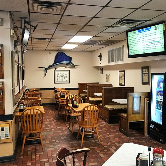 Mounted fish watch over diners from wood-paneled walls—silent testimonials to the maritime bounty that makes this restaurant a destination.