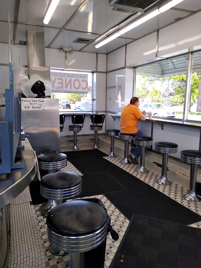Chrome stools and checkerboard flooring create that timeless diner vibe where everyone feels like a regular eventually.