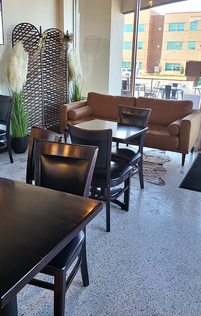 A cozy corner with leather sofa and woven screen creates the perfect backdrop for pie-based contemplation and coffee sipping.