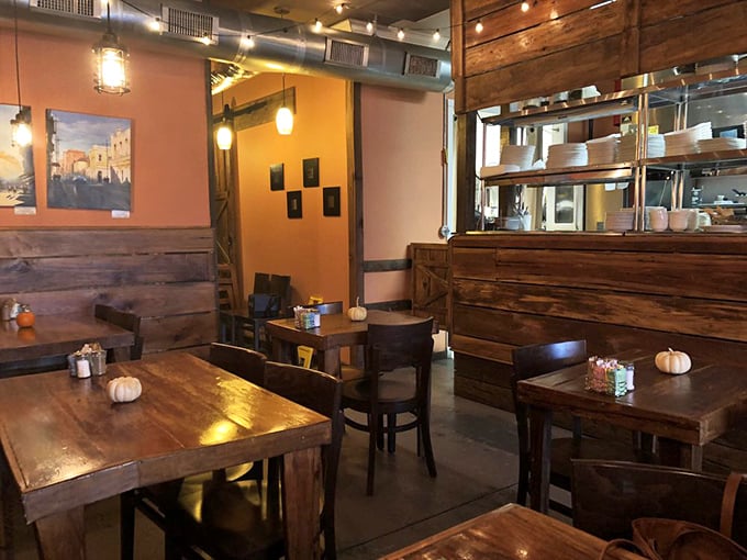 Rustic wooden wainscoting meets warm peach walls, creating that rare atmosphere that's both Instagram-worthy and genuinely comfortable.