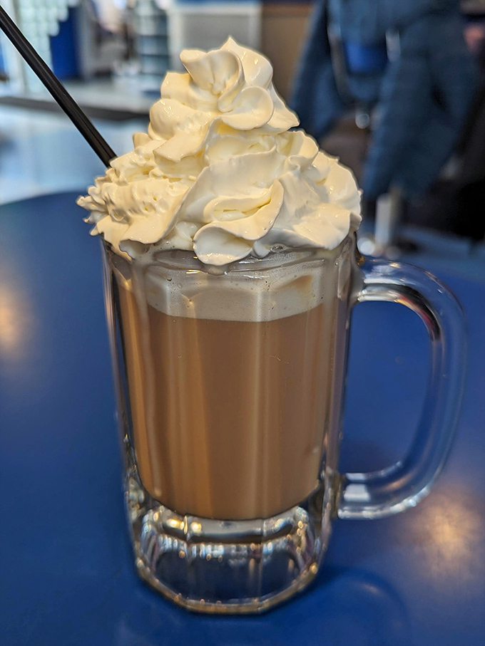 A mug of comfort wearing a cloud hat. This Irish coffee doesn't just warm your hands – it gives your soul a cozy sweater on a Wisconsin winter day.
