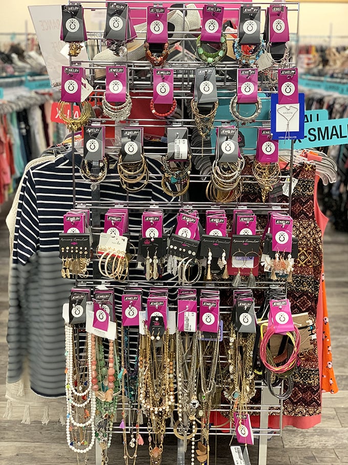 Jewelry sparkles on pink-branded displays, offering the perfect finishing touches that transform "just dressed" into "well-dressed" for pocket change.