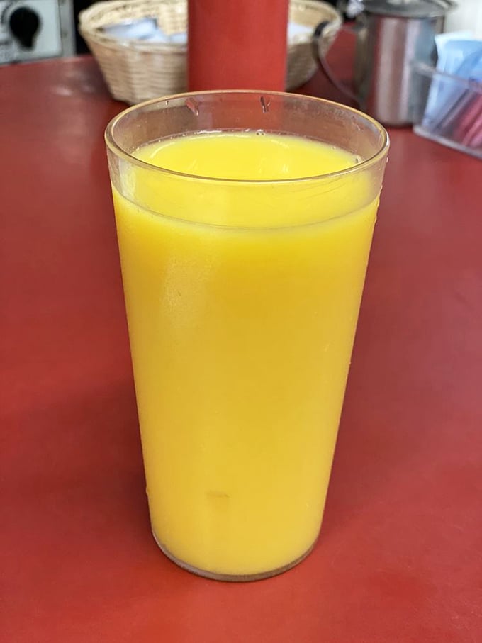 Fresh orange juice glowing like liquid sunshine&mdash;nature's perfect companion to whatever breakfast masterpiece awaits your fork.
