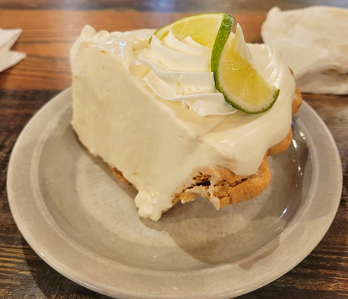 Key lime pie that strikes the perfect balance between tart and sweet. That lime wedge isn't just garnish&mdash;it's a promise of the citrus symphony waiting in every bite.