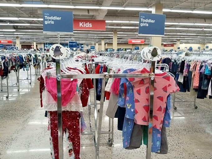 The kids' section bursts with tiny outfits that'll be outgrown before they're outworn, making these prices absolute genius.