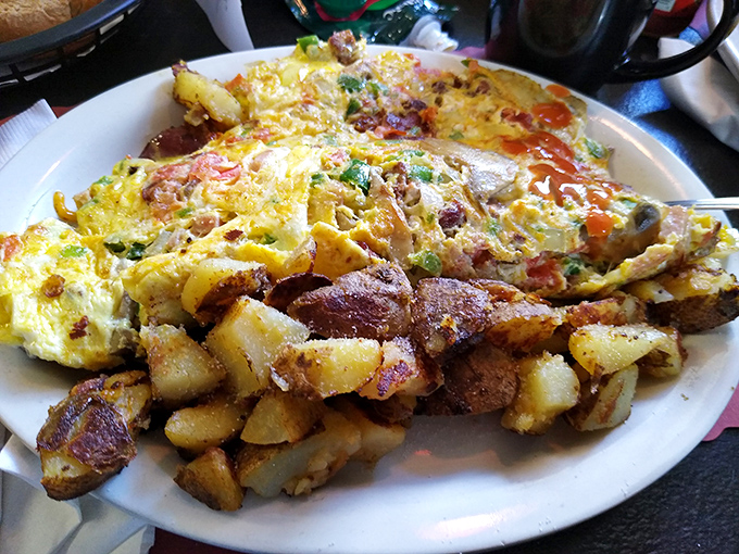 When an omelet meets home fries in perfect harmony. This plate doesn't just feed hunger&mdash;it satisfies the soul's deepest comfort food cravings.