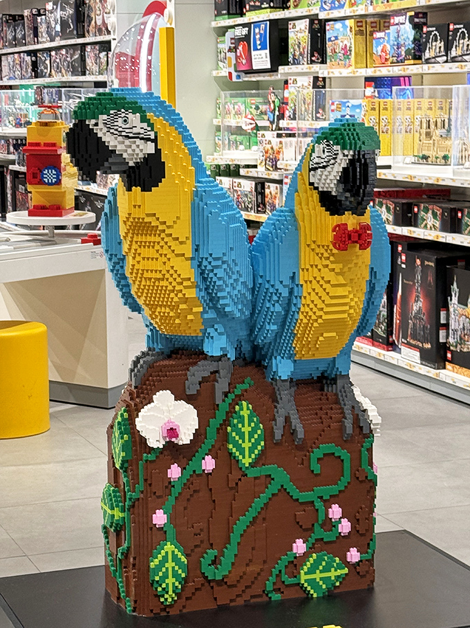 These LEGO parrots prove that shopping malls, like childhood imagination, are evolving far beyond what we remember from the 1980s.