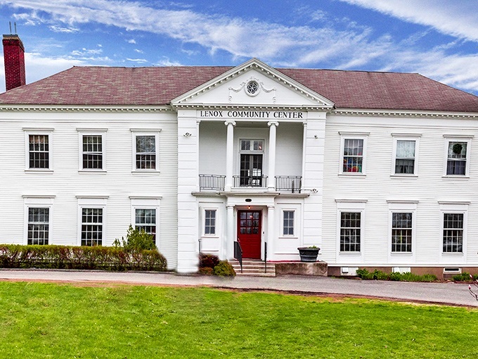 The Lenox Community Center stands proudly in pristine white, like a wedding cake for civic engagement. Where small-town democracy looks as good as it functions.
