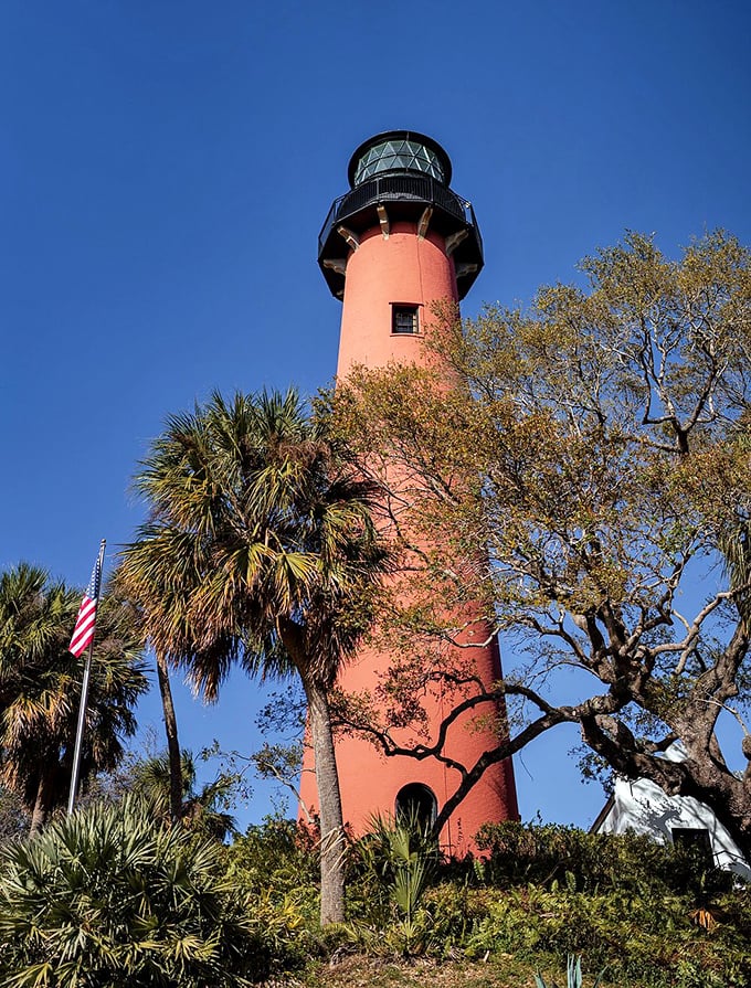 The lighthouse's brick exterior has weathered hurricanes, wars, and countless selfies, yet still stands prouder than a peacock in paradise.