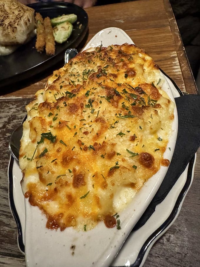 That golden-brown crust on creamy mac and cheese is proof that some comfort foods deserve the fine dining treatment.