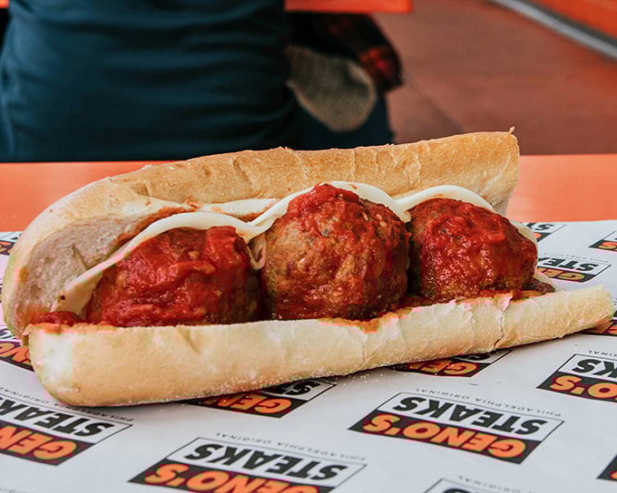 Three meatballs standing proud like Italian monuments. Bathed in rich tomato sauce, they're comfort food that hugs you from the inside.