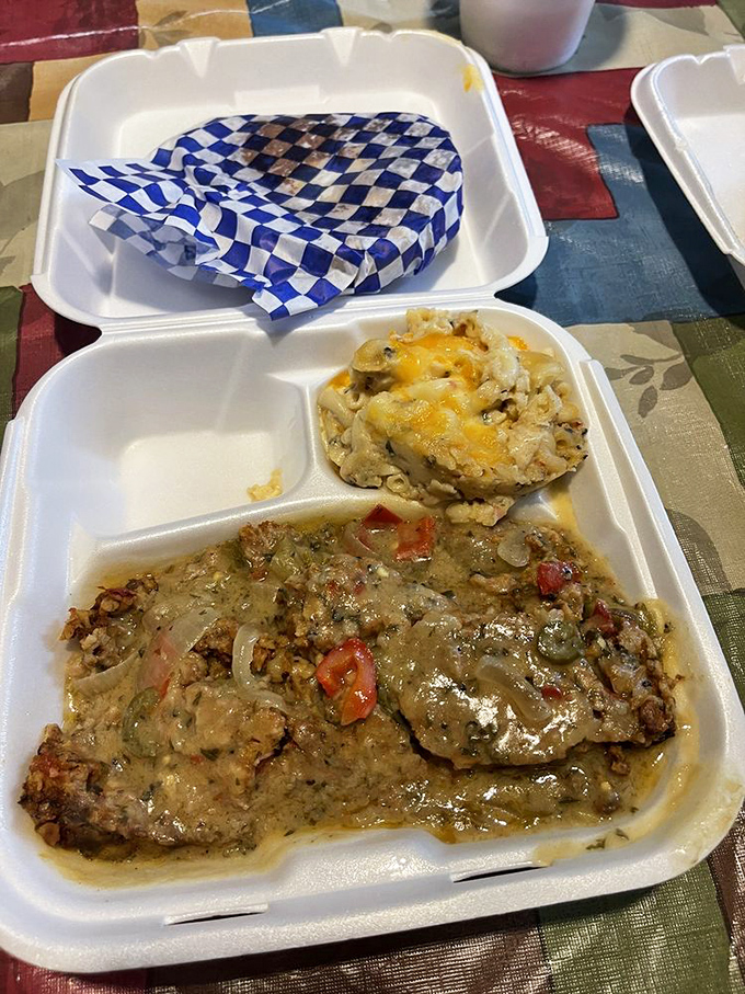 This isn't just meatloaf; it's a savory masterpiece smothered in gravy with mac and cheese that's practically strutting with cheesy confidence. 