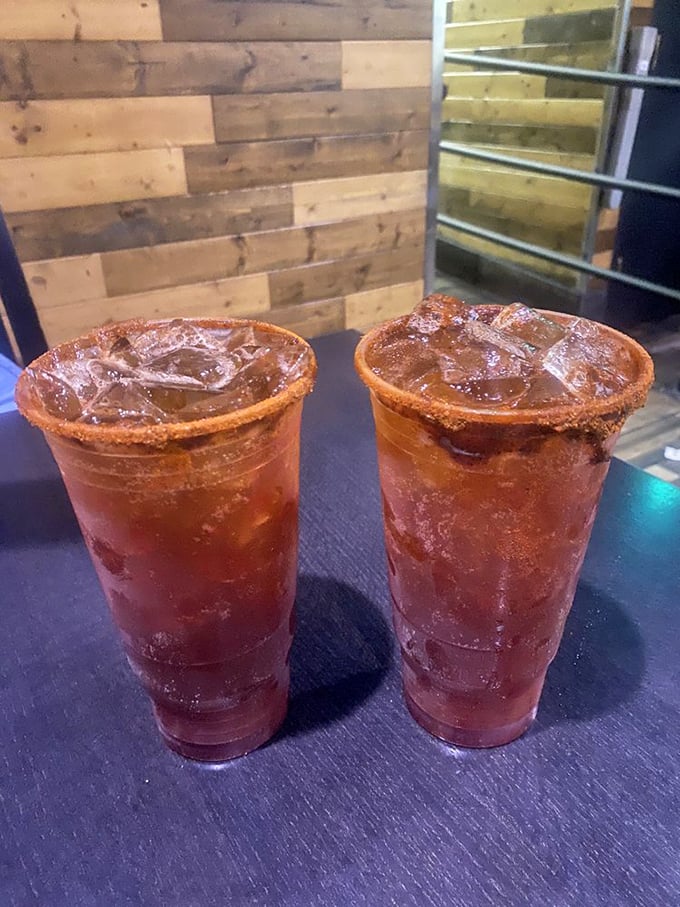Micheladas with their chile-rimmed glasses stand ready to cool the heat, proving that sometimes the best firefighter is actually another kind of fire.