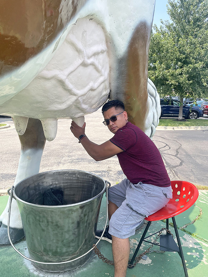 The time-honored tradition of the "milking pose" &ndash; a roadside rite of passage that separates casual travelers from dedicated attraction enthusiasts.