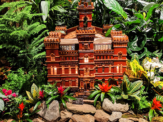 A miniature architectural marvel nestled among tropical plants&mdash;proof that even buildings can have excellent houseplants.