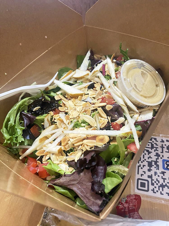 A mixed greens salad that doesn't feel like punishment. Fresh, vibrant, and topped with slivered almonds&mdash;the rare healthy option you'll actually crave.