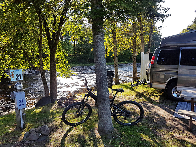 The Moose River campsite offers nature's symphony alongside rushing waters, where adventure begins at the edge of civilization.