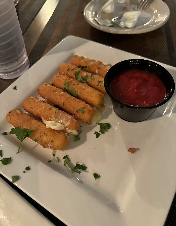 Mozzarella sticks: the comfort food that bridges childhood nostalgia and adult cravings, elevated here with a marinara that means business.
