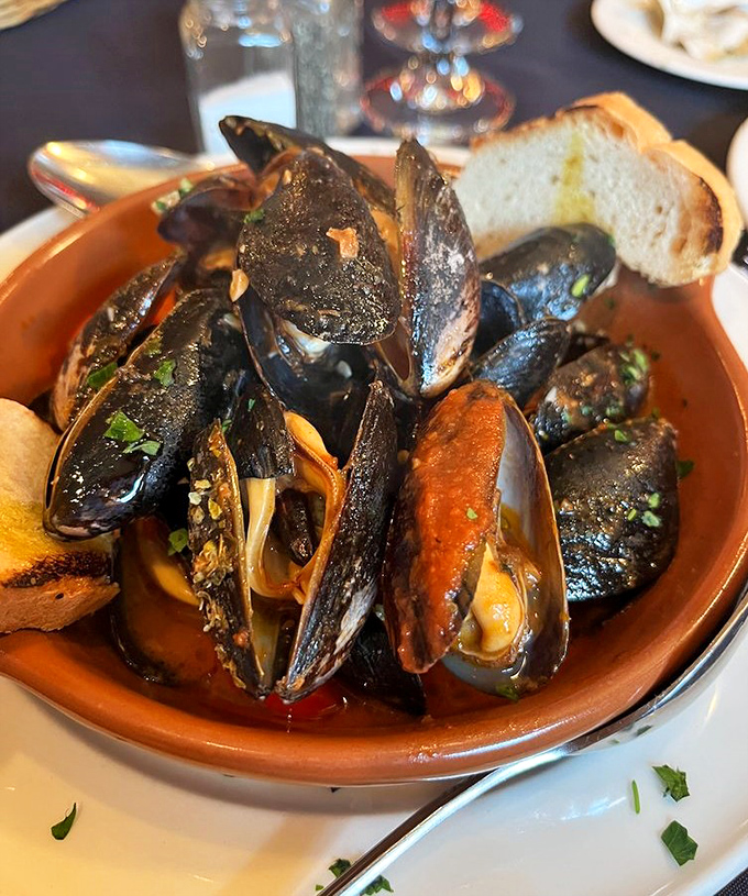 These mussels aren't just opened, they're having a full-blown revelation in a garlicky, herb-infused broth. Bread for dipping: mandatory.