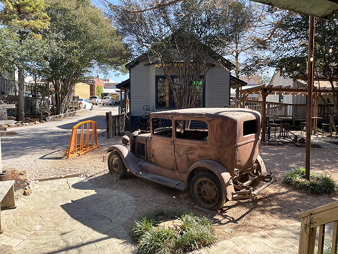 At Neighbor's Kitchen & Yard, that vintage car isn't transportation&mdash;it's a conversation piece that's heard decades of stories over cold drinks.