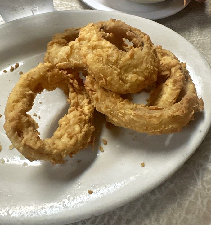 Golden onion rings that crunch like autumn leaves, except way more delicious and less yard work.
