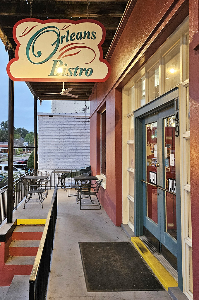 Orleans Bistro's inviting entrance and charming patio create the perfect setting for lingering conversations over meals that bridge Southern and Cajun traditions.