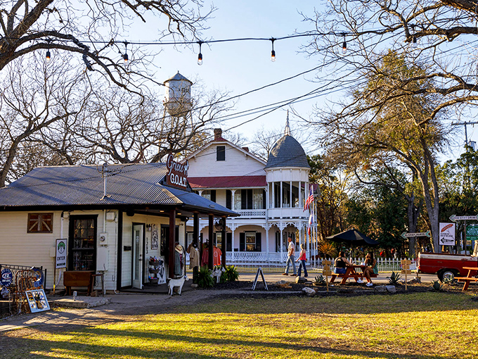 Golden hour bathes The Gruene G.O.A.T in warm light, where shops and Victorian architecture create a scene straight from a storybook.