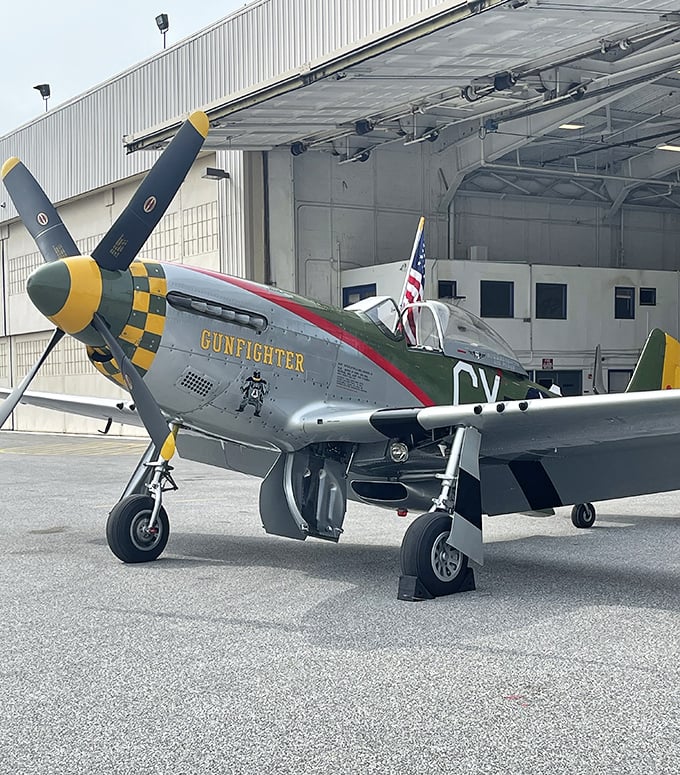 The legendary P-51 Mustang "Gunfighter" sports its distinctive checkered nose&mdash;the aviation equivalent of a perfectly tailored suit with a flashy tie. 