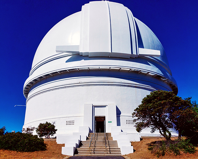 The Palomar Observatory stands like a futuristic temple to science. Where astronomers have been peering into the cosmos since 1948.